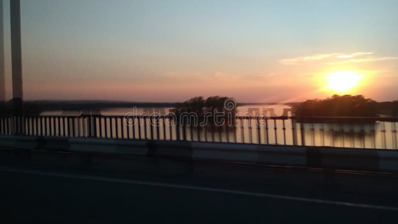 View Across the Bridge Towards the Setting Sun. Side View Stock Video ...