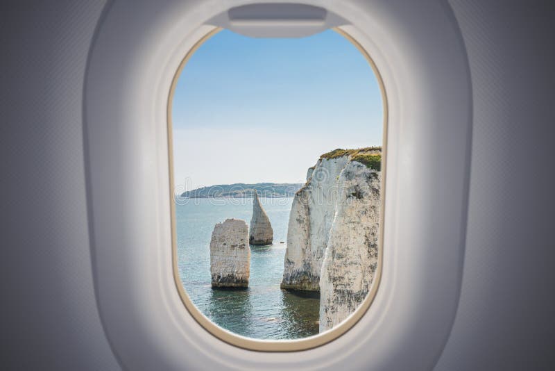 View from Airplane Window on Cliffs Near Sea. Stock Image - Image of ...