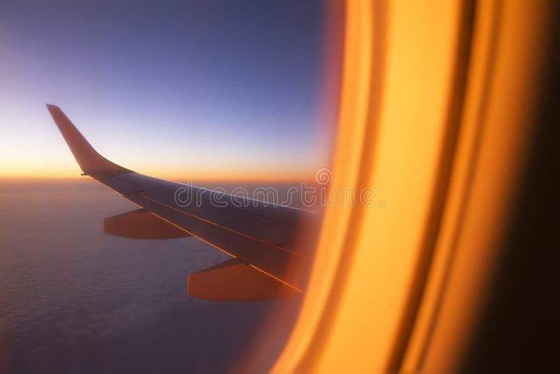 View from the Airplane Window at Dawn during the Flight Stock Photo ...