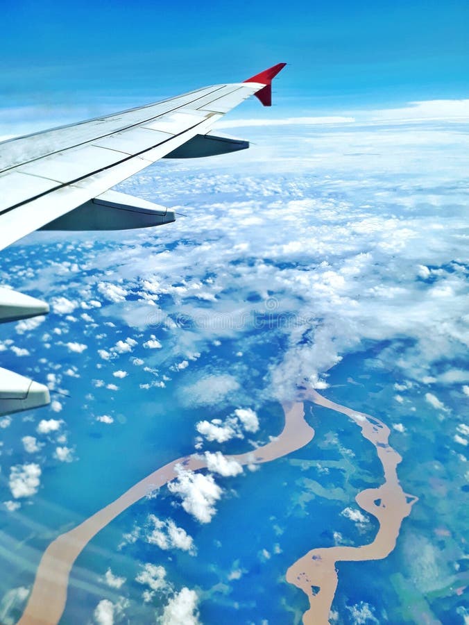 View from an Airplane Window during a Flight Over a River in the Amazon ...