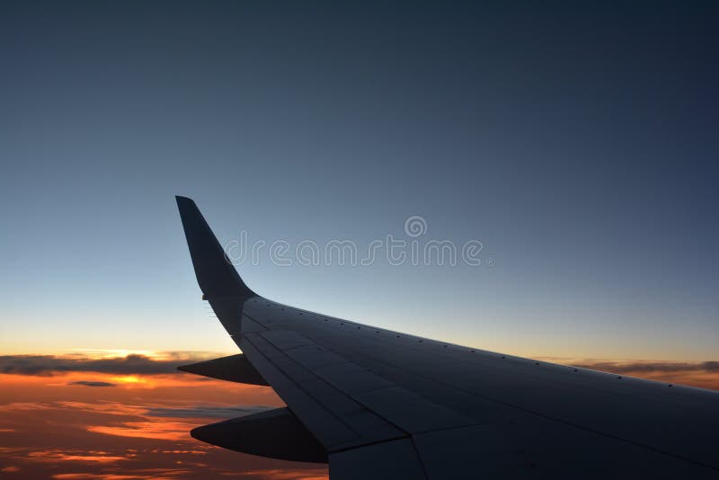 View from an Airplane Window Showing the Wing and the Sunset Stock ...