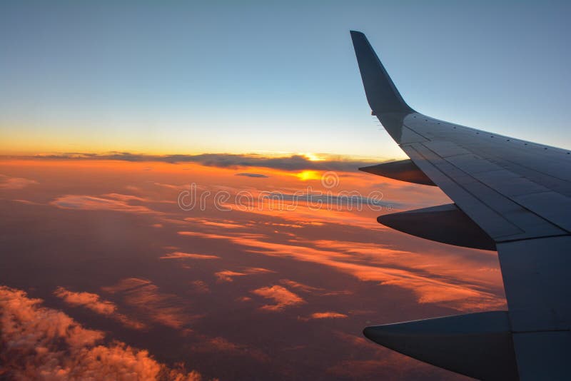 View from an Airplane Window Showing the Wing and the Sunset Stock ...