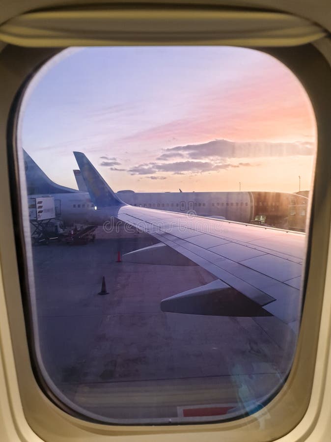View from the Airplane Window on the Wing at Susnet Stock Photo - Image ...