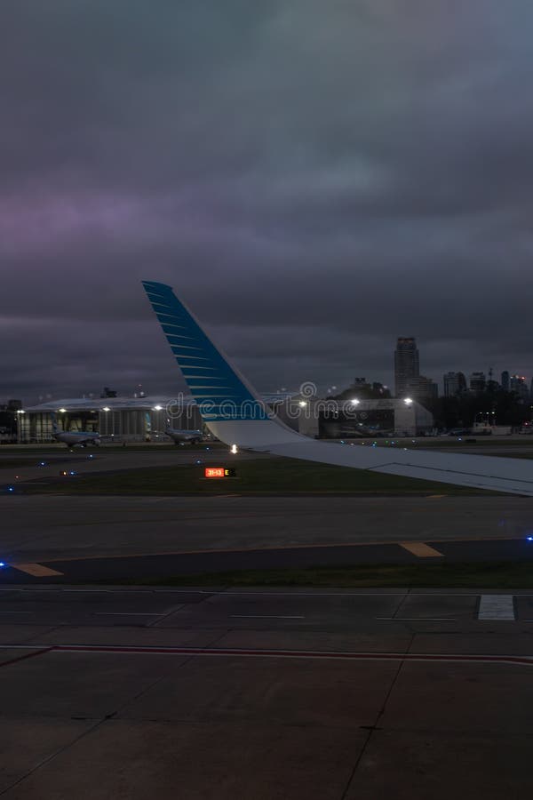 View of Airplane Wing with a City Background Editorial Stock Image ...