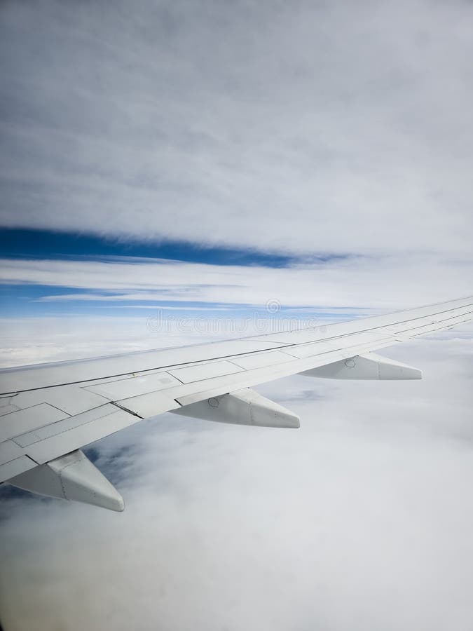 View of Airplane Wing Mid Flight Stock Image - Image of white, airplane ...