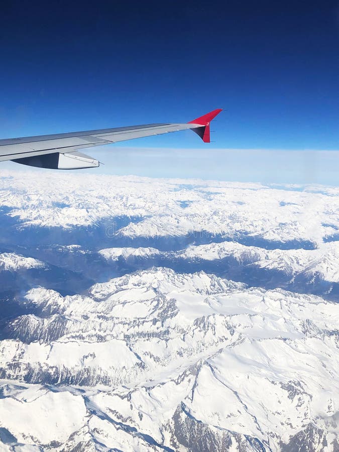 View on Airplane Wing and Mountains with Snow Stock Image - Image of ...