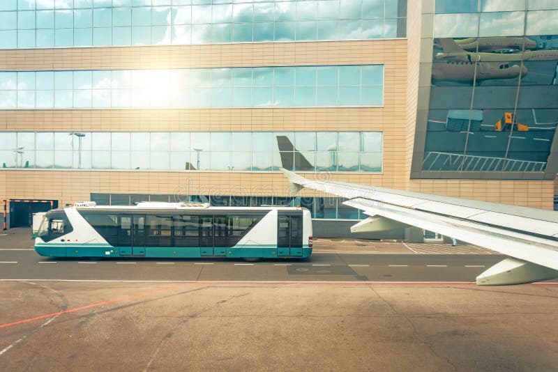 View from an Airplane Wing of a Passenger Bus Passing by in the ...