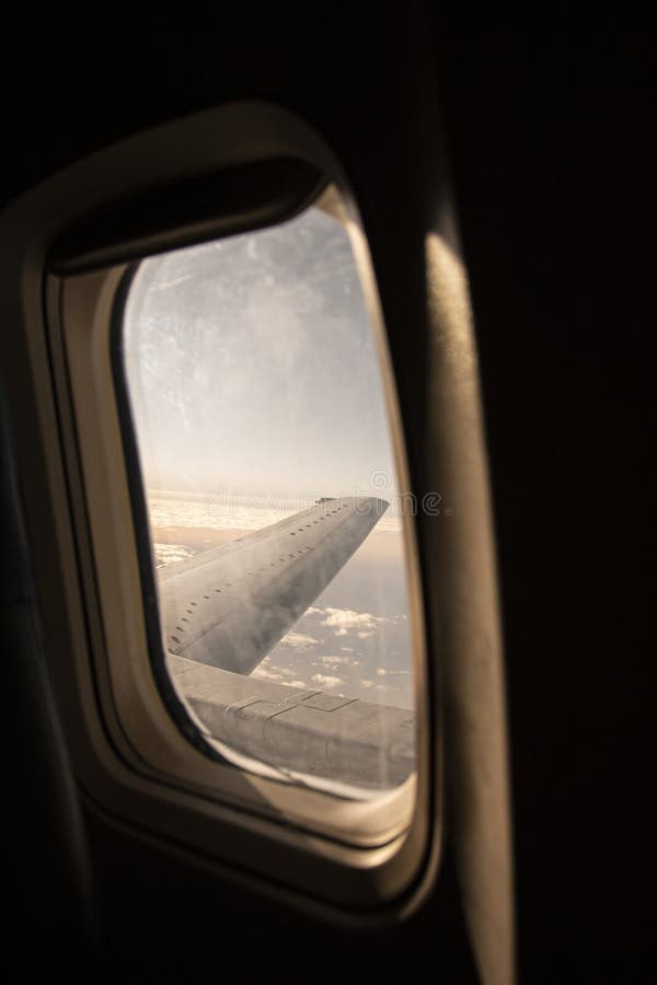 View of an Airplane Wing Seen through the Glass Window Stock Photo ...