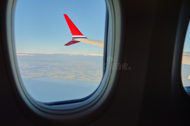 View of Airplane Wing from an Airplane Window Stock Photo - Image of ...