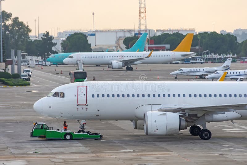 View of the Airport Platform, the Plane Rolls Out the Tow Tractor Push ...