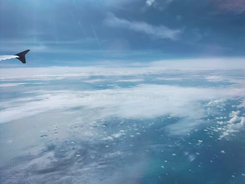 View of Amazing Cloud Formation Above Blue Ocean, Seen from Airplane ...