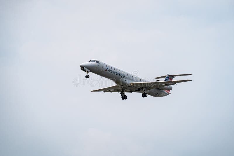 View of American Eagle Airplane Flying in the Sky. Editorial ...