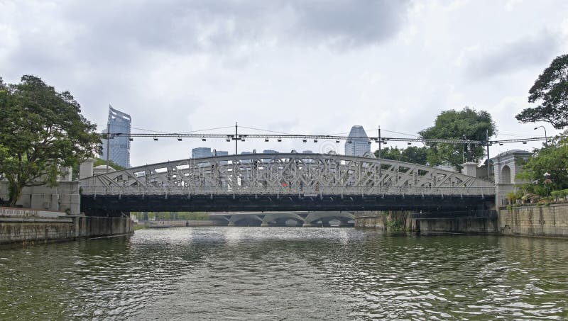 The Anderson Bridge Across the Singapore River with the Fullerton Hotel ...