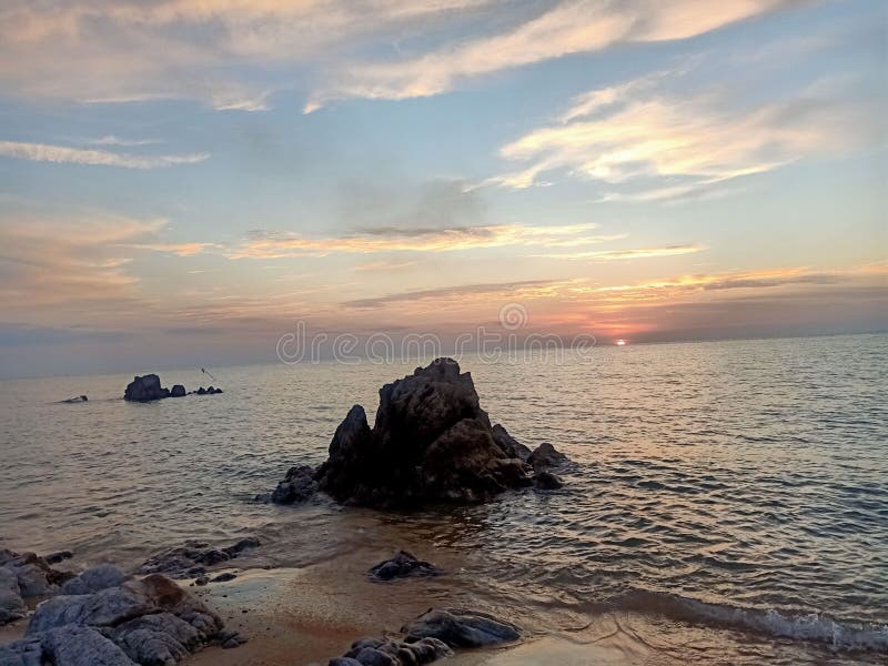A View in Aore Day Sunset on the Beach and Calm Sea Water? Stock Image ...
