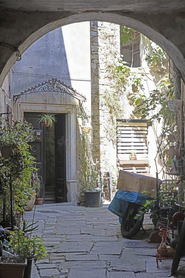 View through an Archway into the Backyard of an Old Stone Building ...