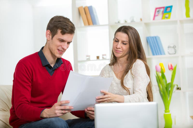 View of an Attractive Couple Doing Administrative Paperwork Stock Image ...