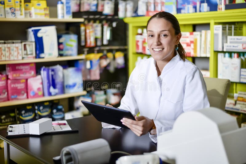 View of an Attractive Pharmacist at Work Stock Image - Image of ...