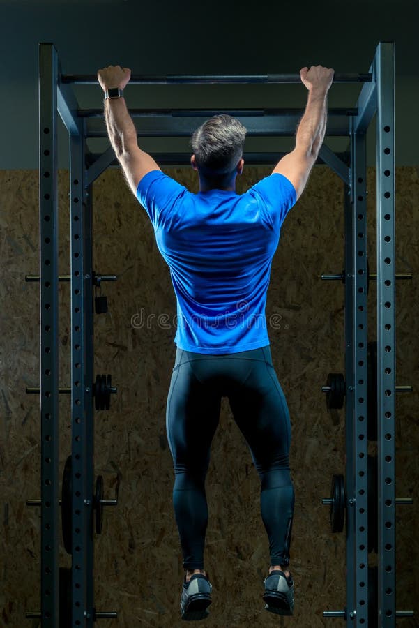 View from the Back of an Athlete Pulls Up on the Bar Stock Photo ...