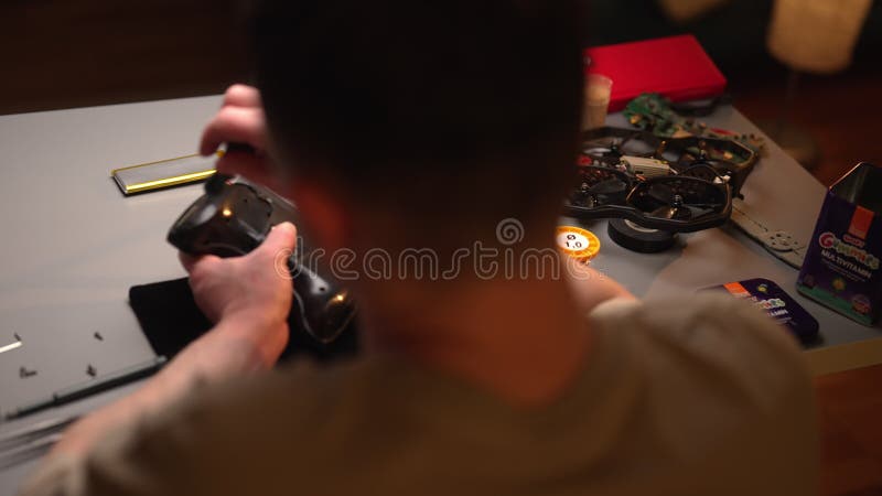 View from Back of Electronic Technician Assembling or Repairing Drone ...