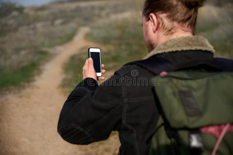 View from the Back of a Hiking Adventurer Man Using Compass on ...