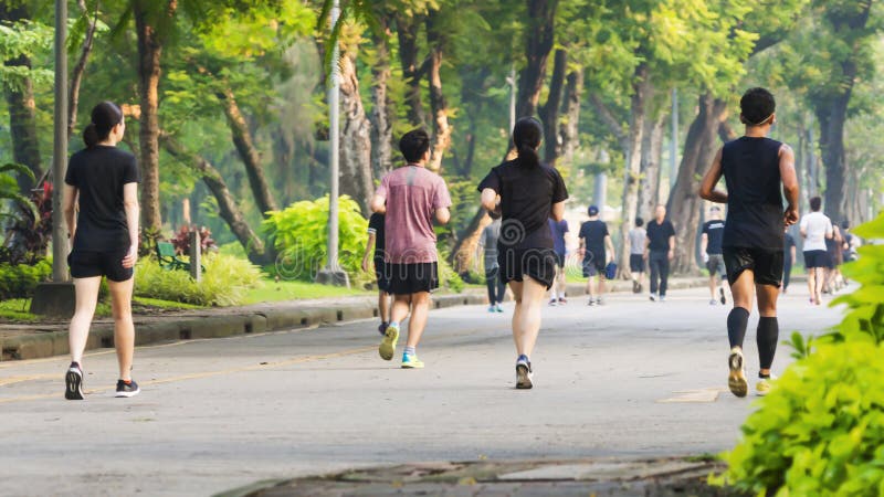 View of Back of People Run and Walk at Pedestrian Garden Park Stock ...