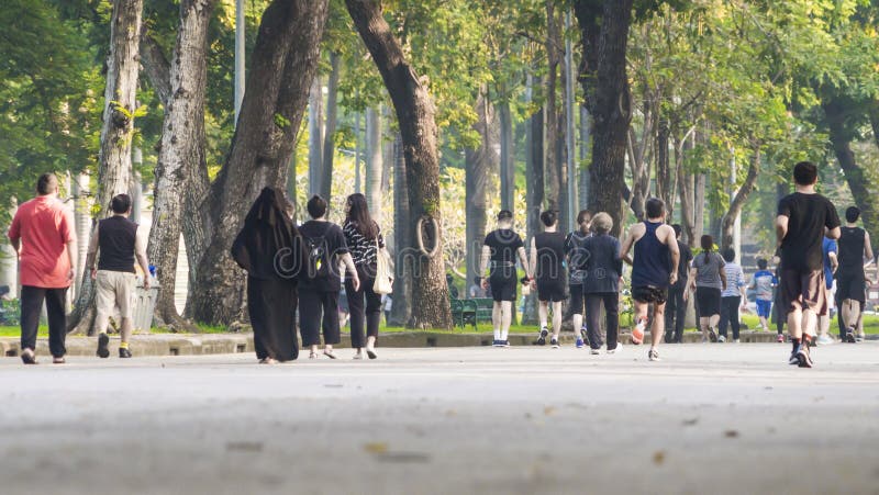 View of Back of People Run and Walk at Pedestrian Garden Park Editorial ...