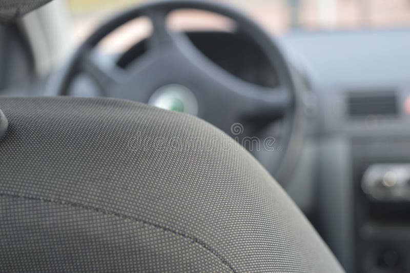 View from the Back Seat of a Car Showing the Steering Wheel and Dash ...