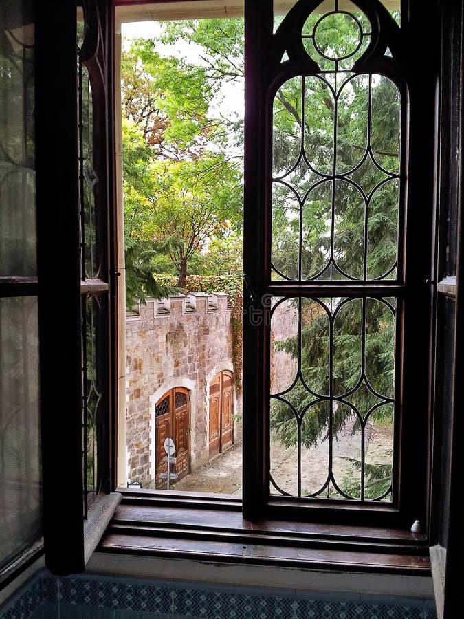 View of the Backyard through a Half-open Window in the Castle Stock ...