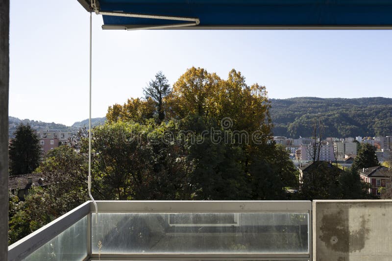 View from a Balcony, Green Trees and Green Mountains in the Background ...