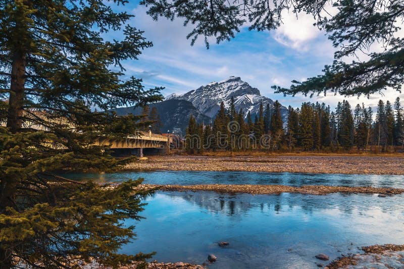 Branches Framing Banff Mountains and Bow River in the Spring Stock ...