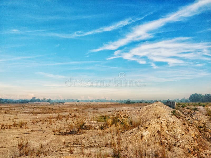 The view in a barren land stock photo. Image of field - 250890574