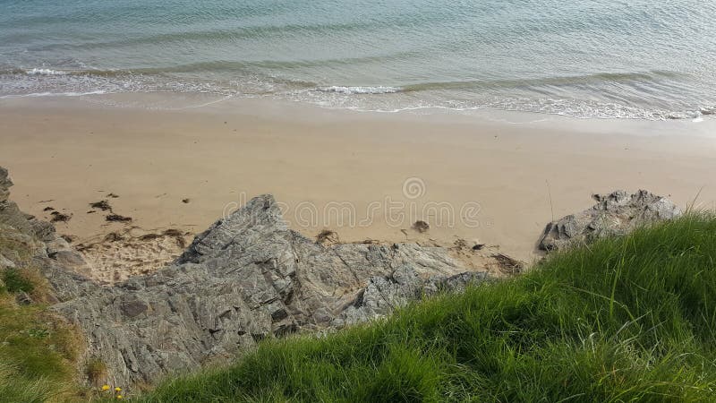 Beach view from cliff edge stock photo. Image of rock - 277055000