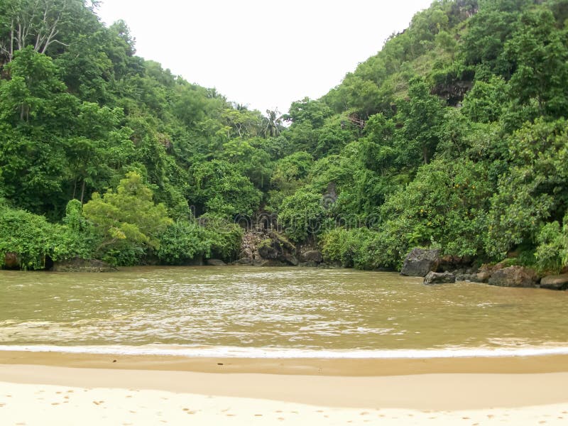 View of the Beach with a Hill Background Stock Image - Image of ...