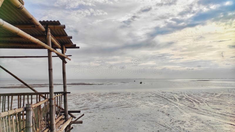 View of the Beach Receding at Sunrise Stock Image - Image of sunrise ...