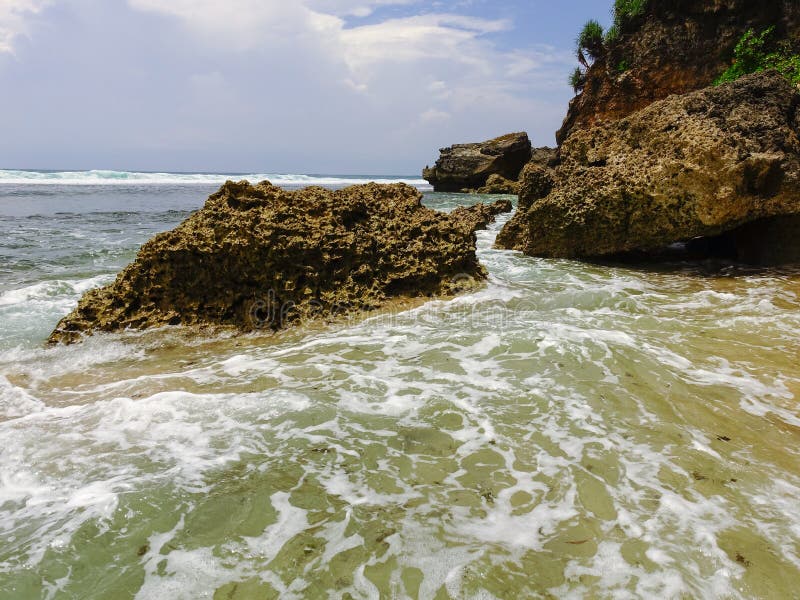 View on the Beach with Rock, Sand, Wave and White Cloud Stock Photo ...