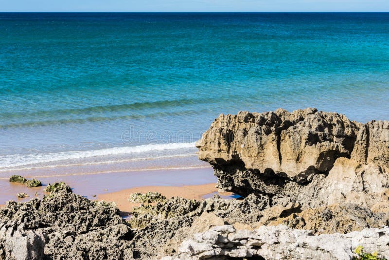 View of the Beach with Rocks and Sand between Cliffs Stock Photo ...