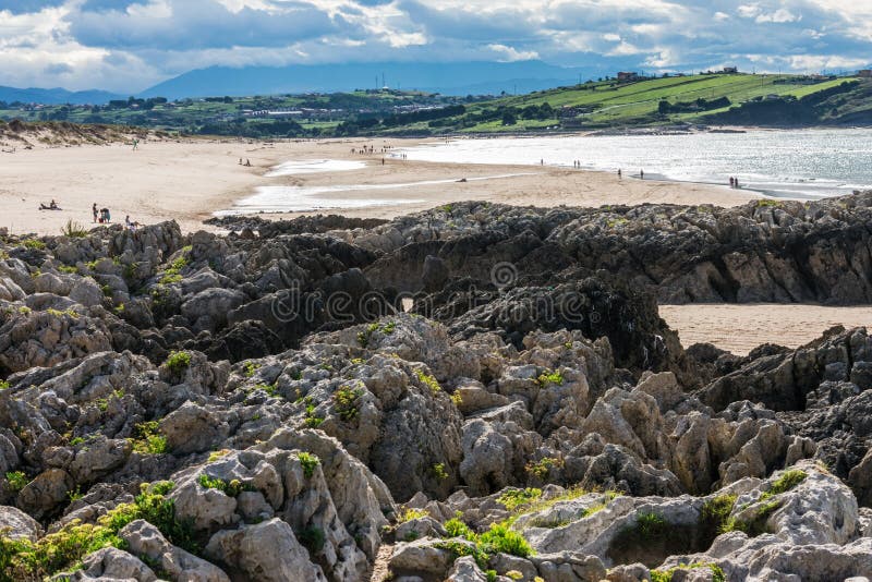 View of the Beach with Rocks and Sand between Cliffs Stock Image ...