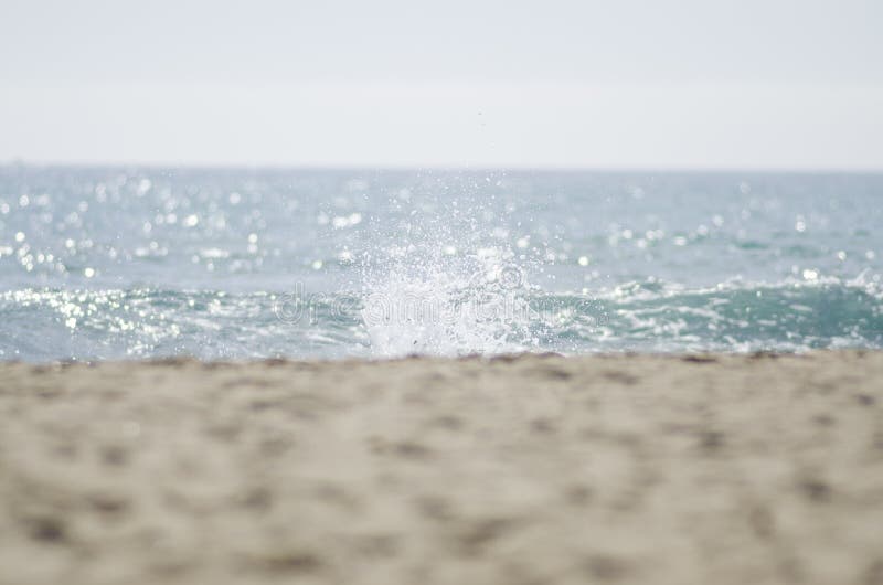 View Of Beach And Sea Out Of Focus And A Splash Of The Sea On Fo Stock ...