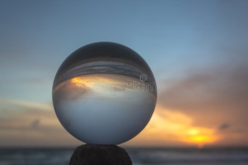 View of the Beach in Sunset Inside Three Crystal Ball Stock Photo ...