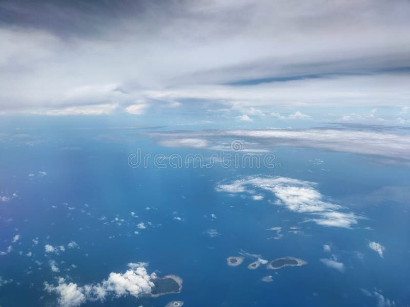 View of Beautiful Blue Ocean and Small Islands at Center, Under Amazing Cloudy Sky Stock Photo ...