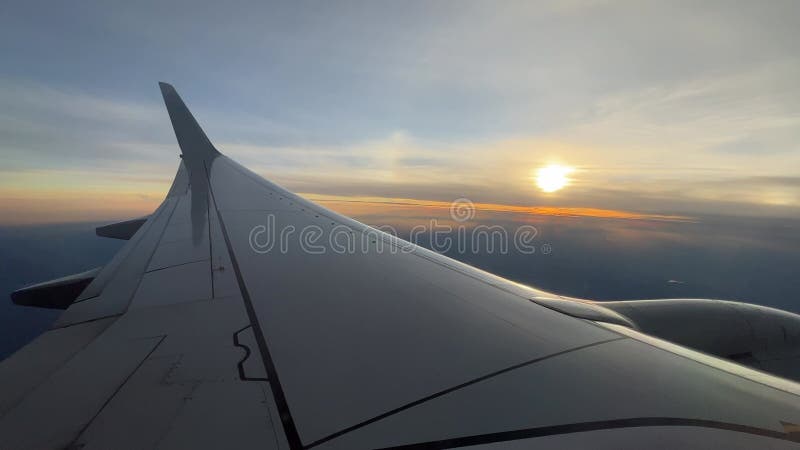 View of a Beautiful Sunset Sky from an Airplane Window with the Wing ...