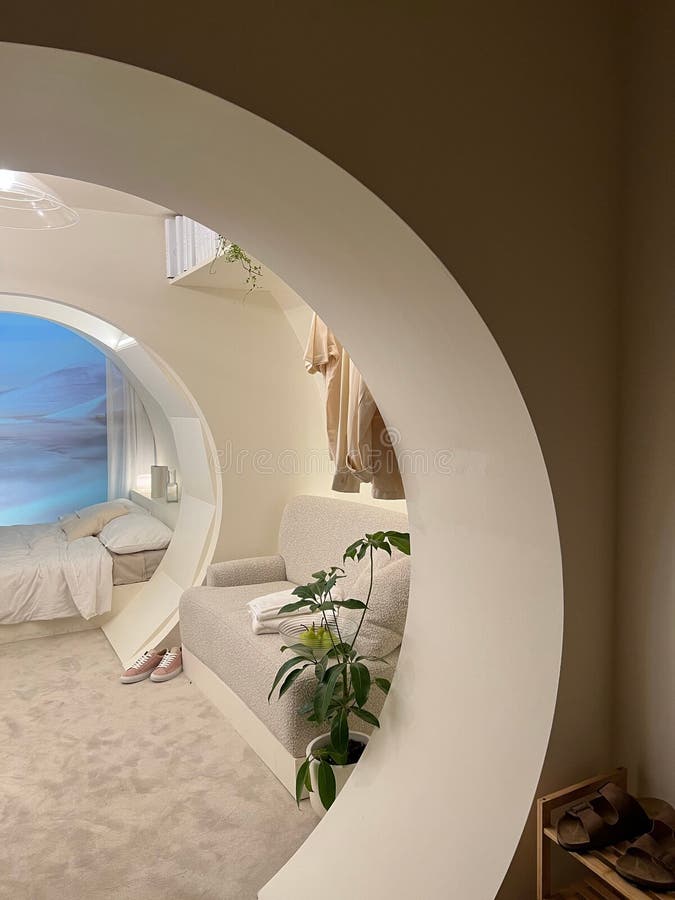 View into the Bedroom through an Arch in a Curved Wall Stock Photo ...
