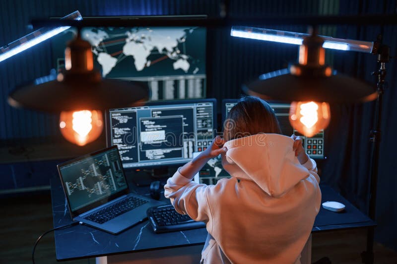 View from Behind. Young Professional Female Hacker is Indoors by ...