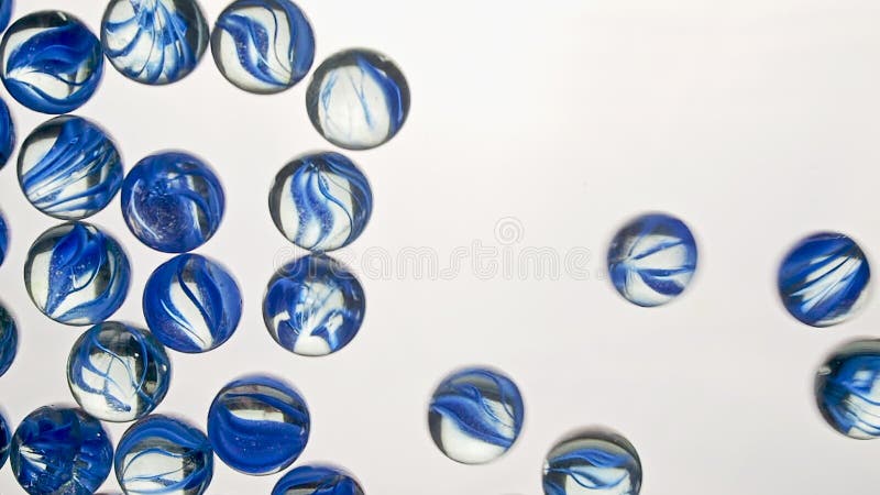 View from Below As the Hand Throws Small Blue Colored Plastic Balls ...