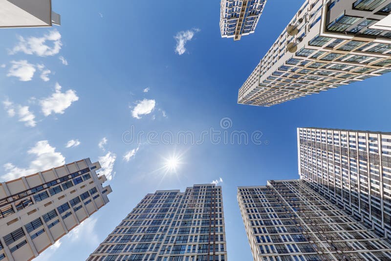 View from Below into Blue Sky with Clouds of Large Modern Skyscraper ...