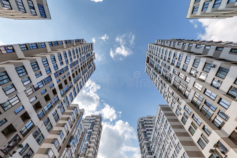 View from Below into Blue Sky with Clouds of Large Modern Skyscraper ...