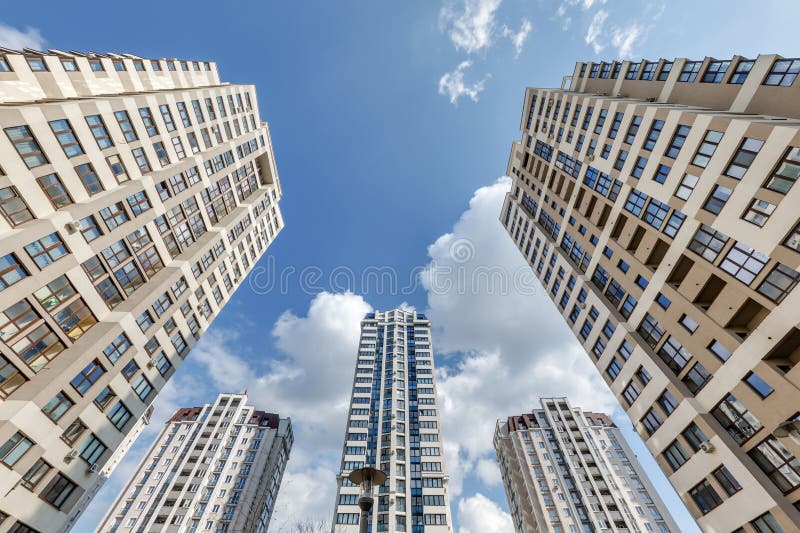 View from Below into Blue Sky with Clouds of Large Modern Skyscraper ...