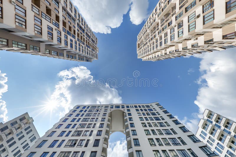 View from Below into Blue Sky with Clouds of Large Modern Skyscraper ...