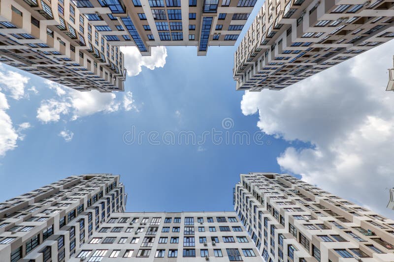 View from Below into Blue Sky with Clouds of Large Modern Skyscraper ...