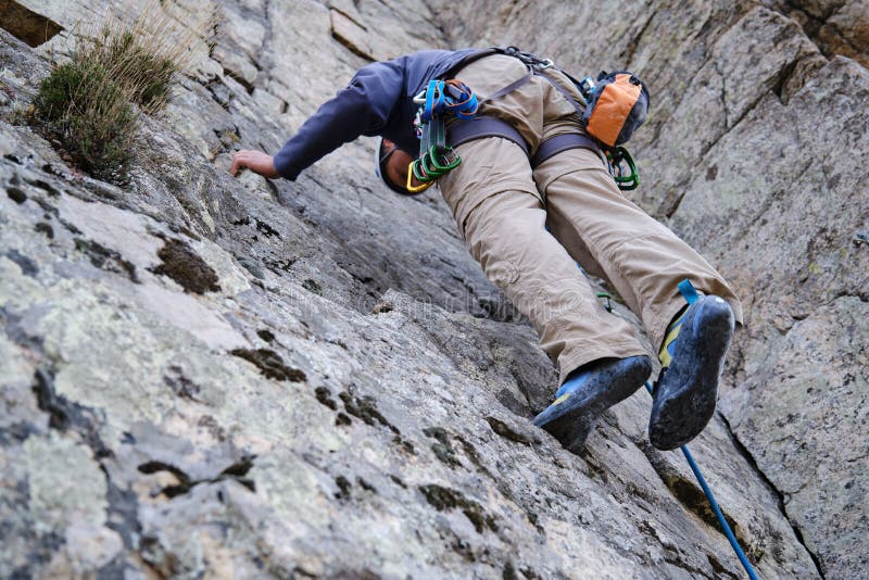 View from Below of a Man Climbing a Wall Stock Image - Image of ...